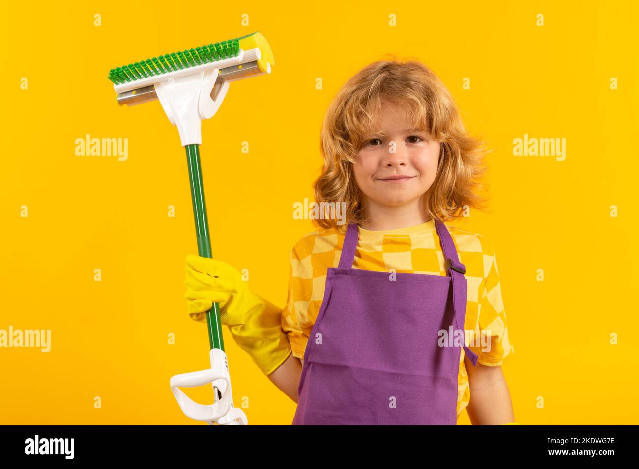 Child doing housework. Child use duster and gloves for cleaning. Funny ...