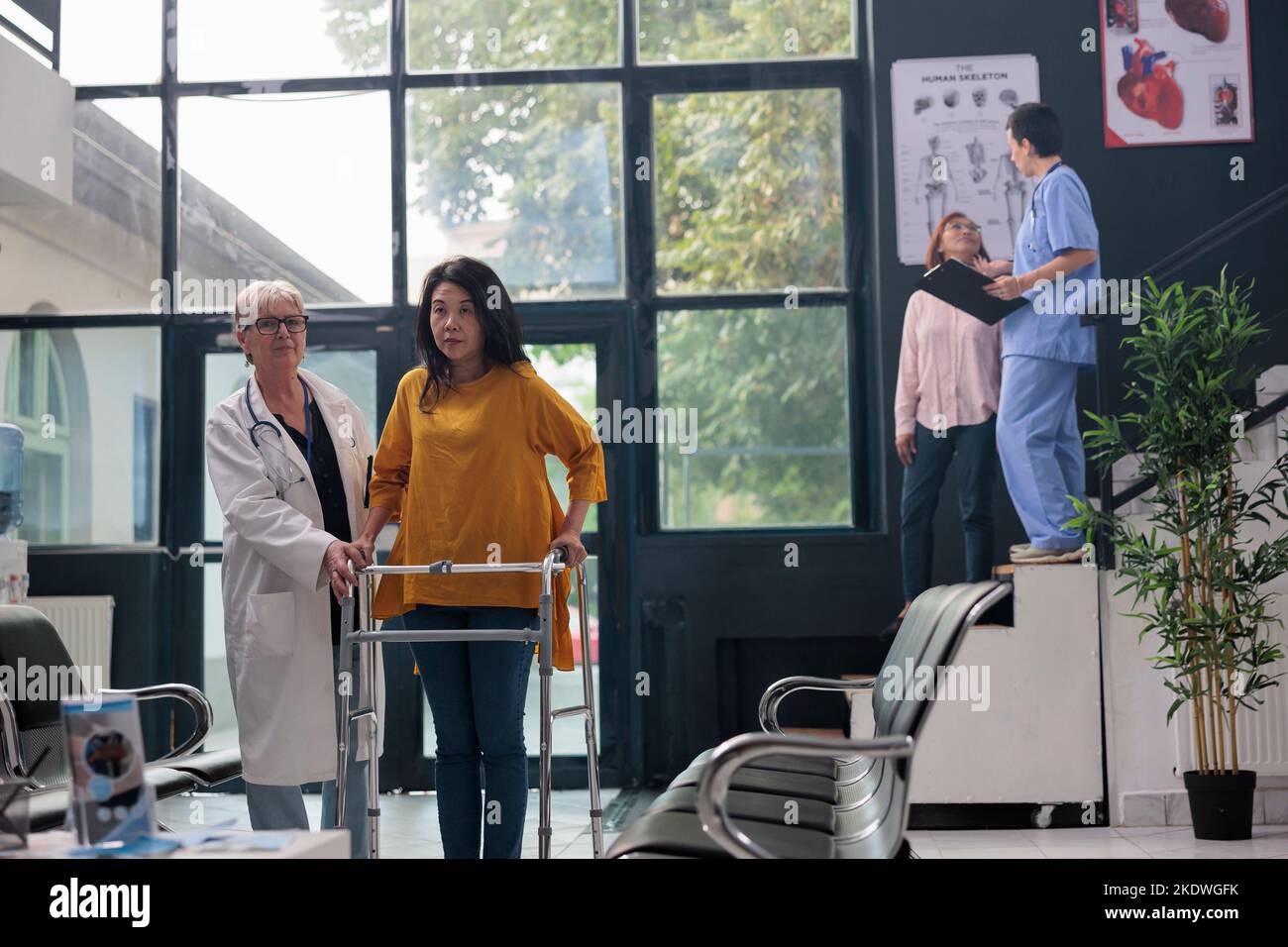 Asian woman with leg injury walking with walk frame and doing ...