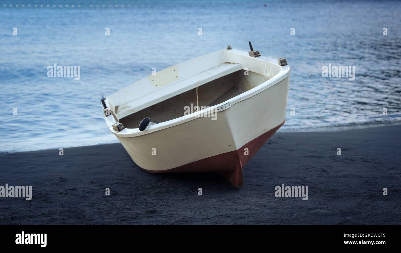 White Rowboat on a deserted beach Stock Photo - Alamy
