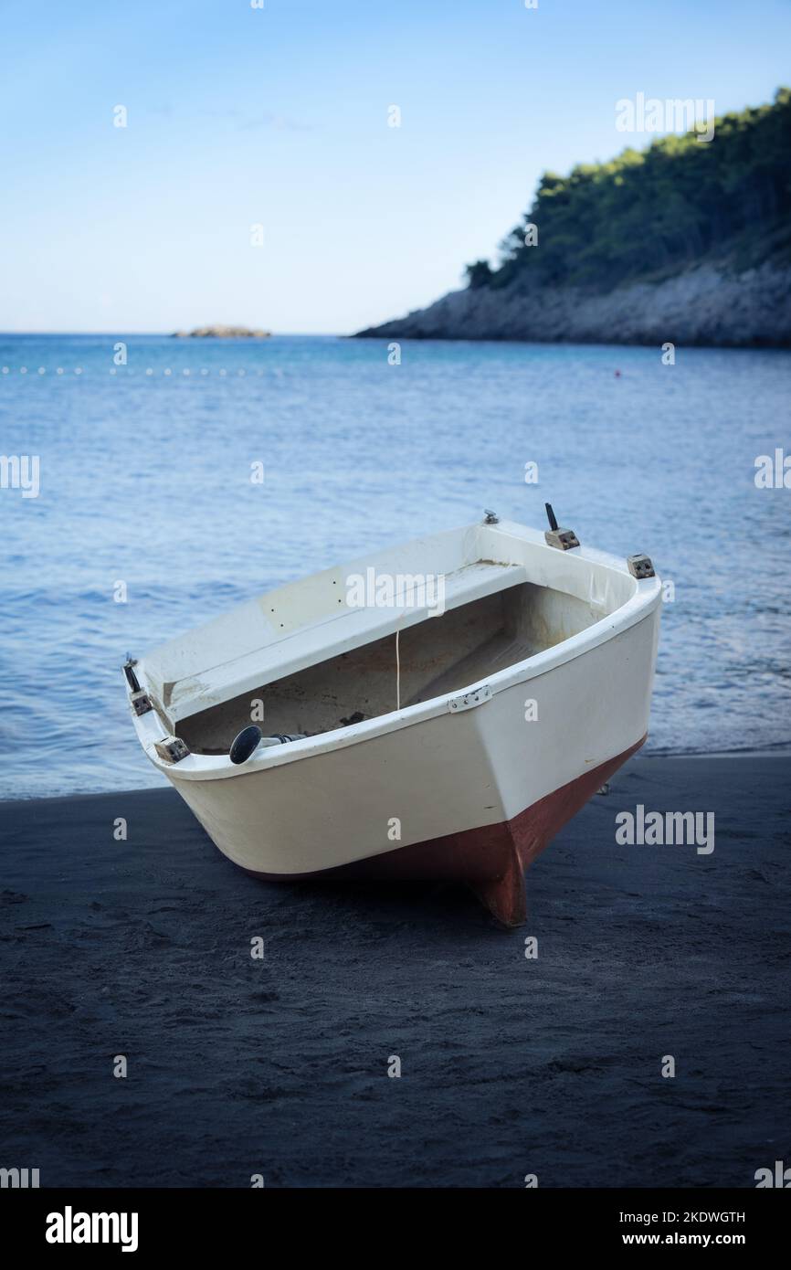White Rowboat on a deserted beach Stock Photo - Alamy