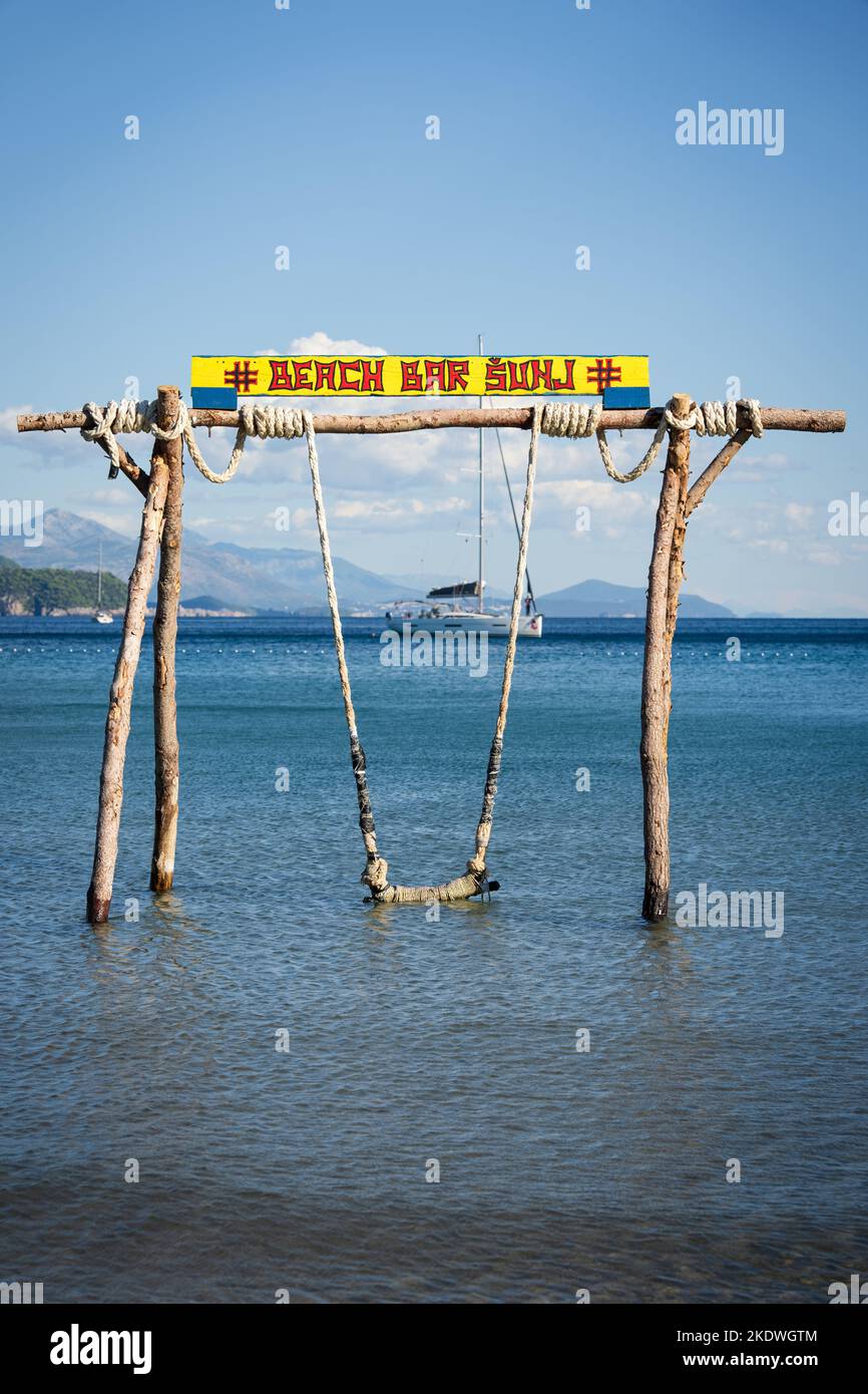 Water swing on Sunj Beach, Lopud Island Stock Photo - Alamy