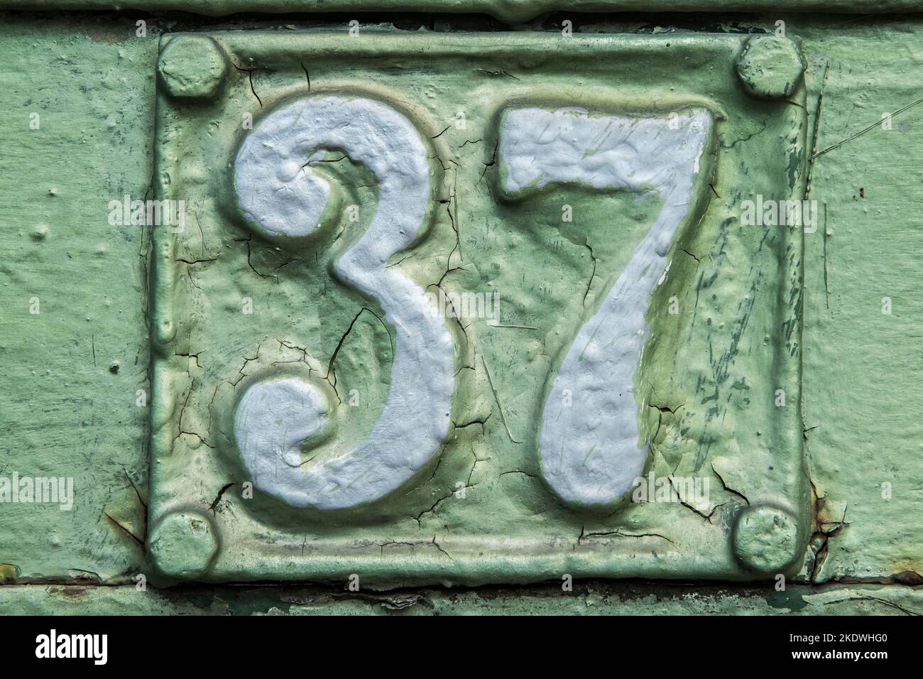 Old retro weathered cast iron plate with number 37 closeup Stock Photo ...