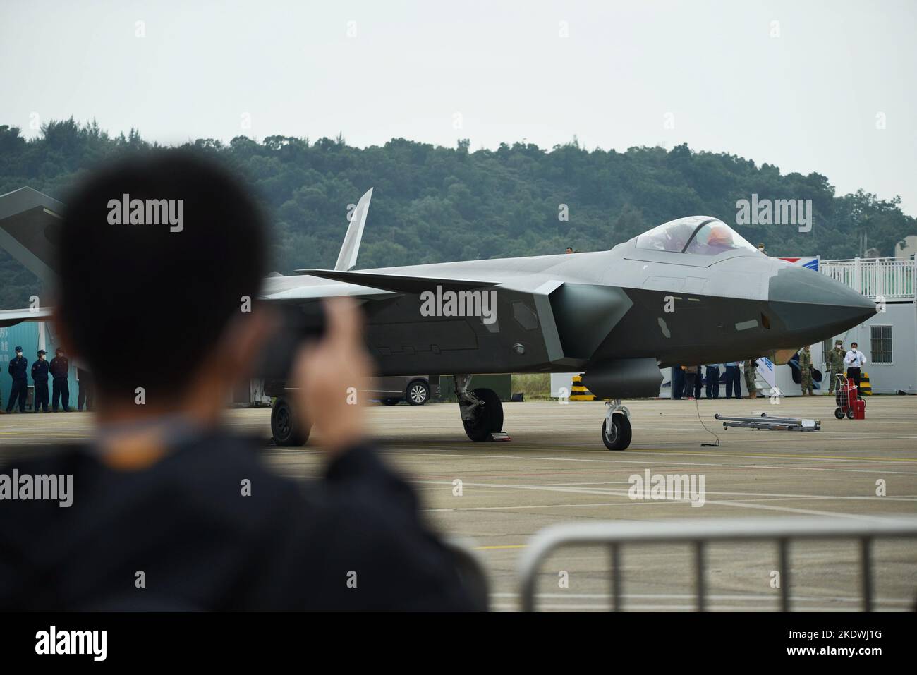 ZHUHAI, CHINA - NOVEMBER 8, 2022 - Visitors look at the Chengdu J-20 ...