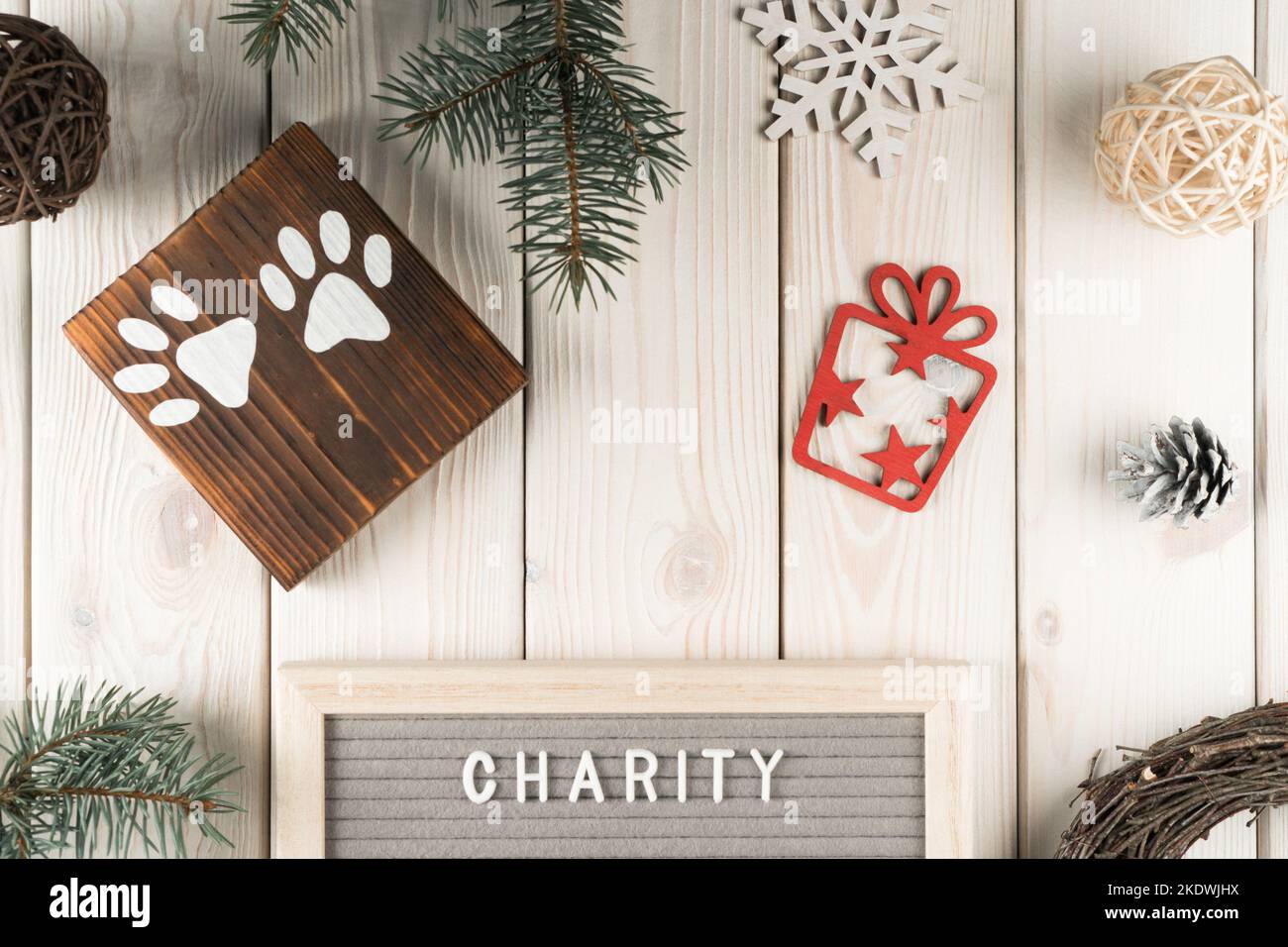 Creative festive composition of wooden board with animal paws symbol ...