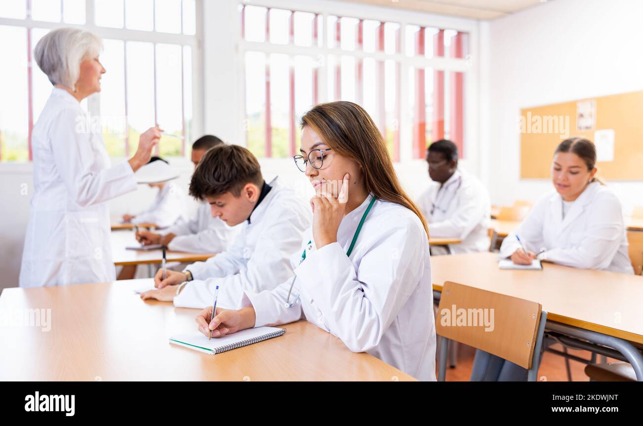 Girl medical student listening to lecture in classroom Stock Photo - Alamy