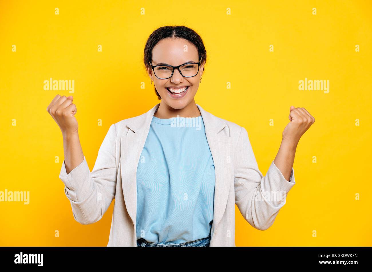 Win, success. Overjoyed mixed race business woman with glasses ...