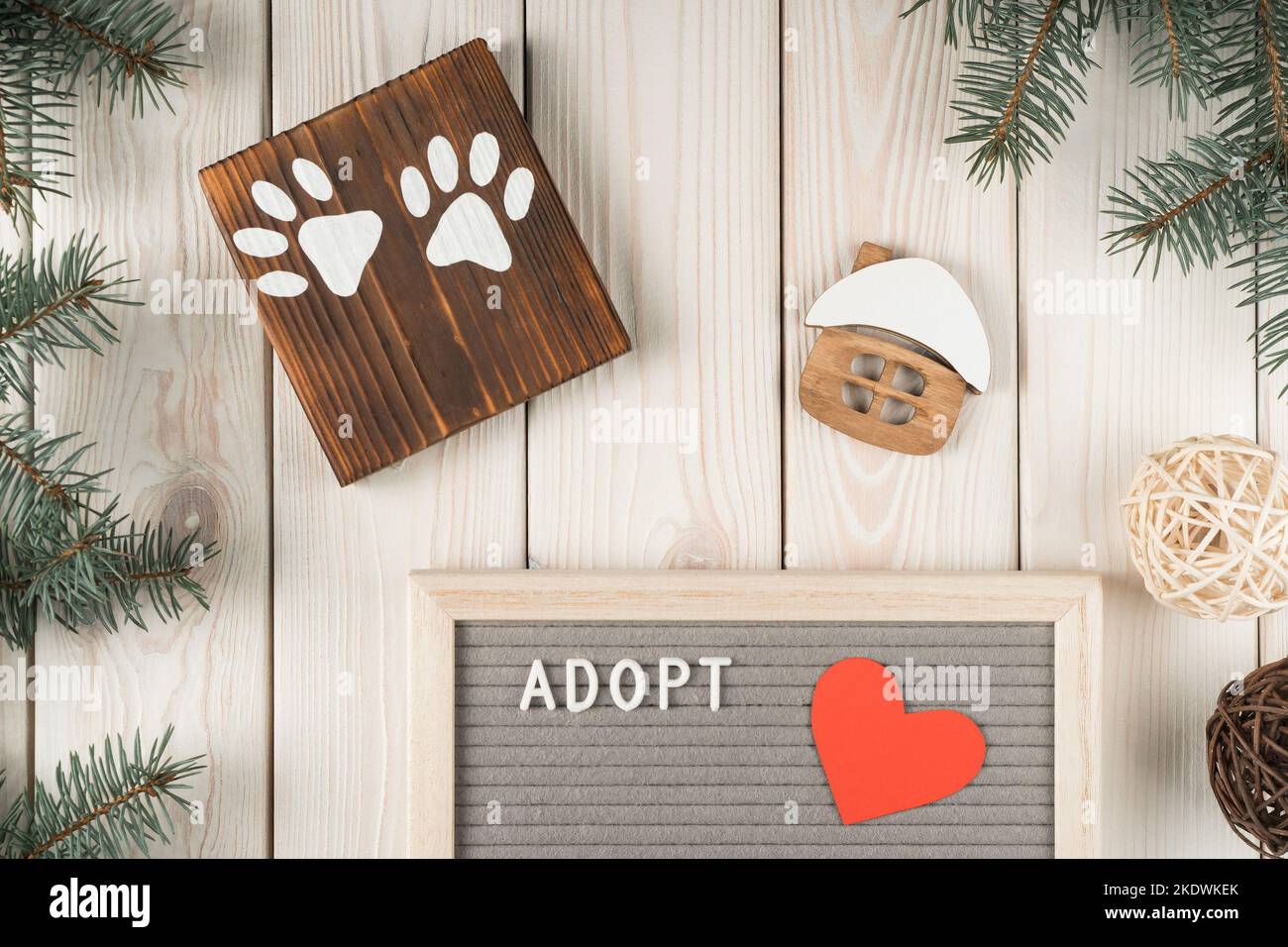 Art creative composition of wooden board with two animal paws, house ...
