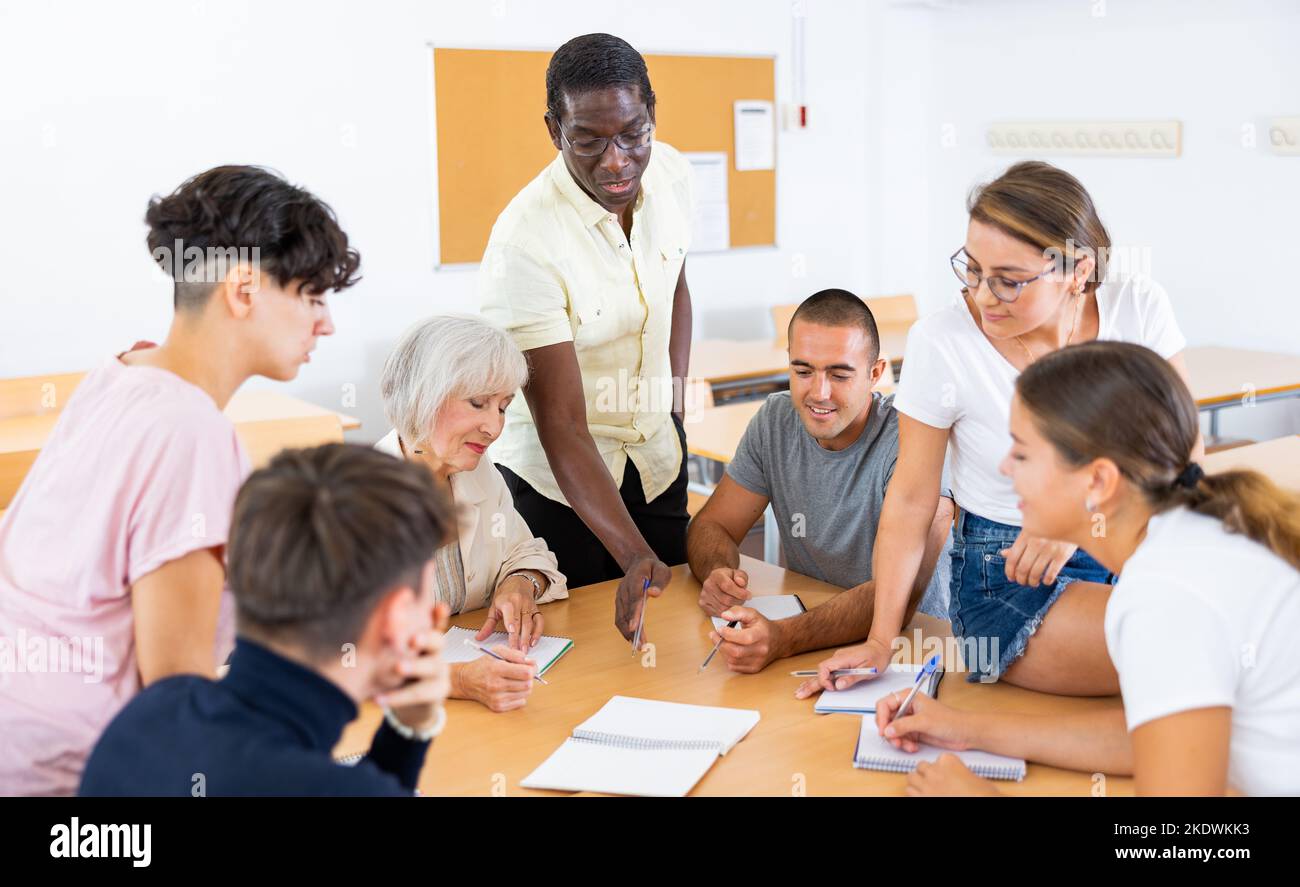 Group of people attending language course Stock Photo - Alamy