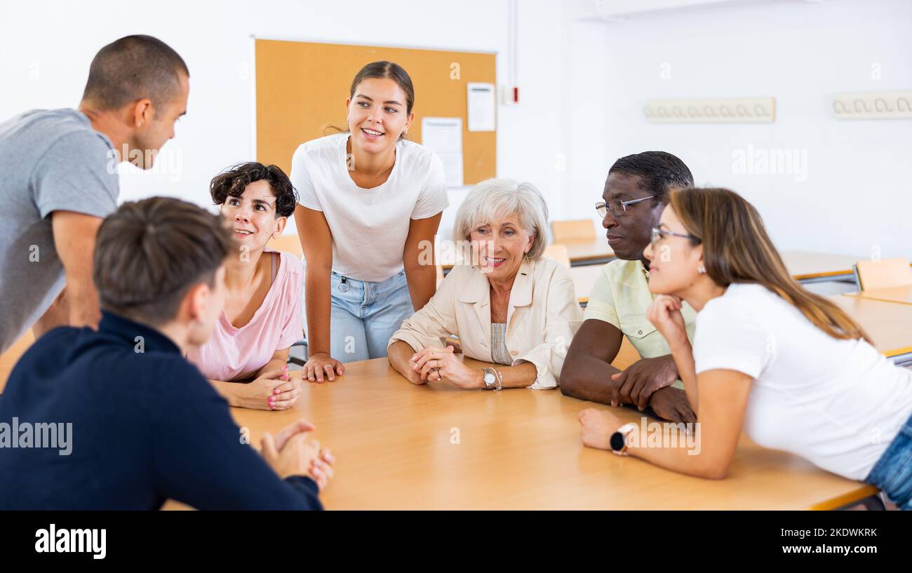 Group of people attending language course Stock Photo - Alamy