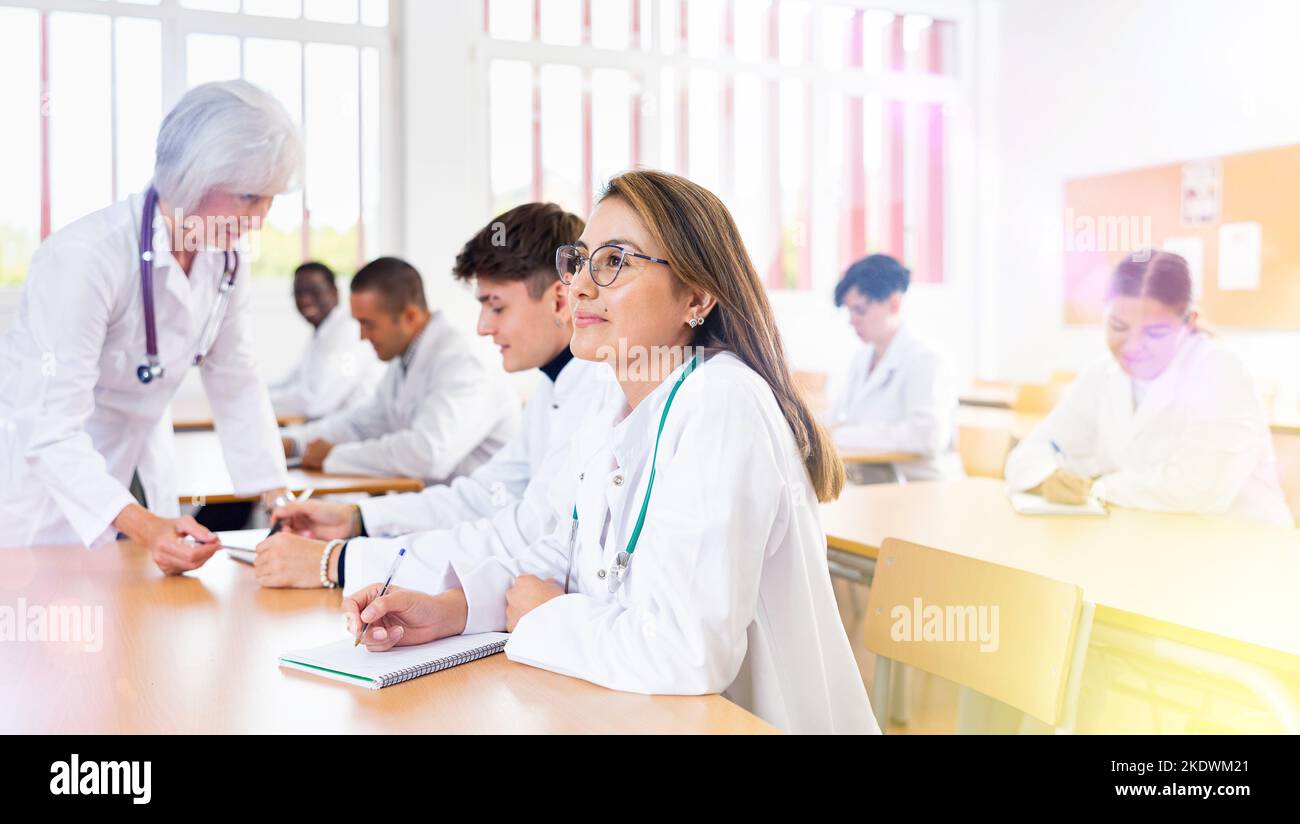 Young woman medical student attending lecture in university Stock Photo ...