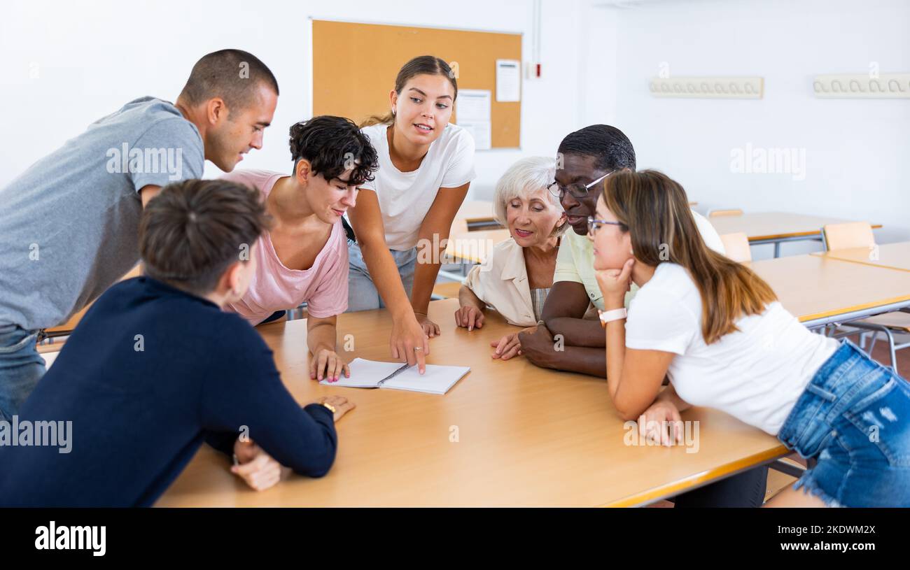 Diverse people on language courses in classroom Stock Photo - Alamy