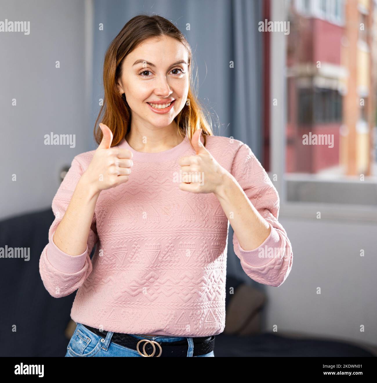 Portrait of a positive young woman Stock Photo - Alamy