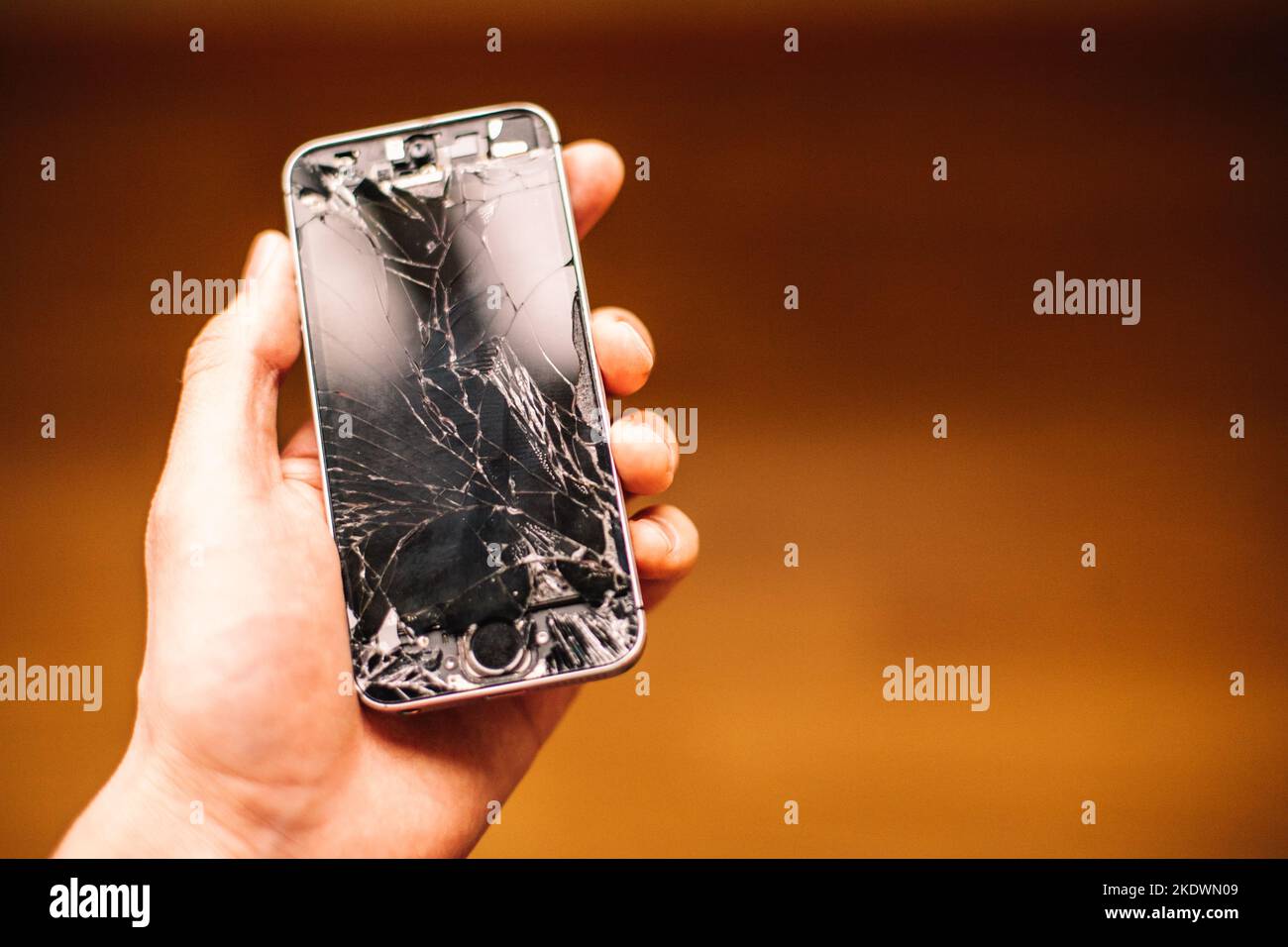 Person holding in hand broken smart phone with cracked screen Stock ...