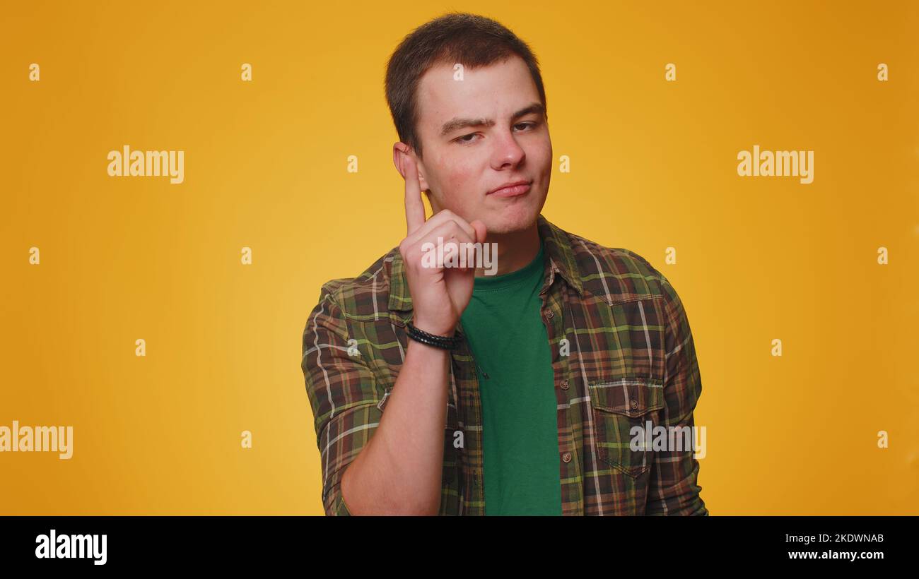 Displeased man shakes finger and saying no, be careful, scolding and ...