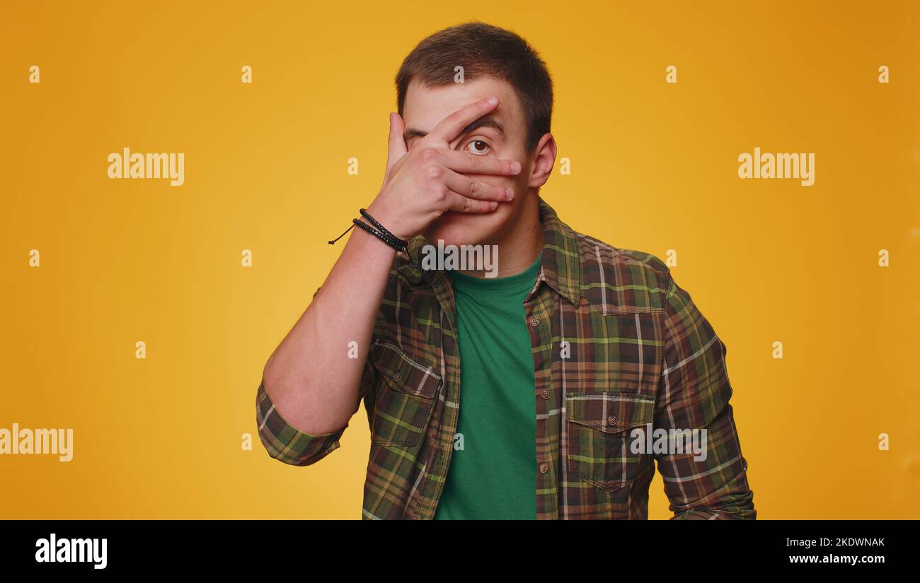 Dont want to look at this, awful. Handsome shocked teen man closing ...