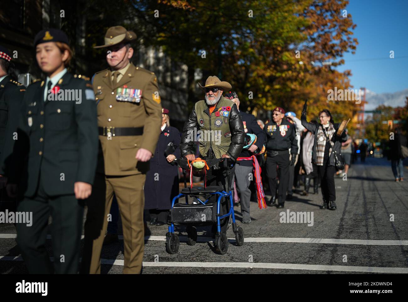 Aboriginal Canadian Army veteran David Ward, centre, marches to a ...