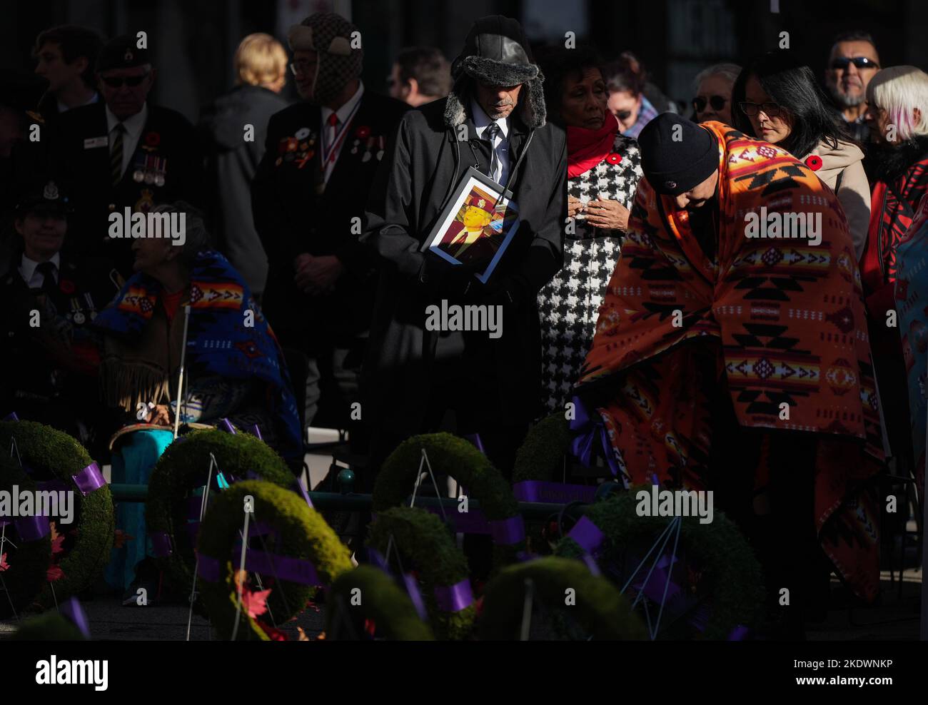 Richard Campbell, of the Musqueam Indian Band, wears a photo of his ...