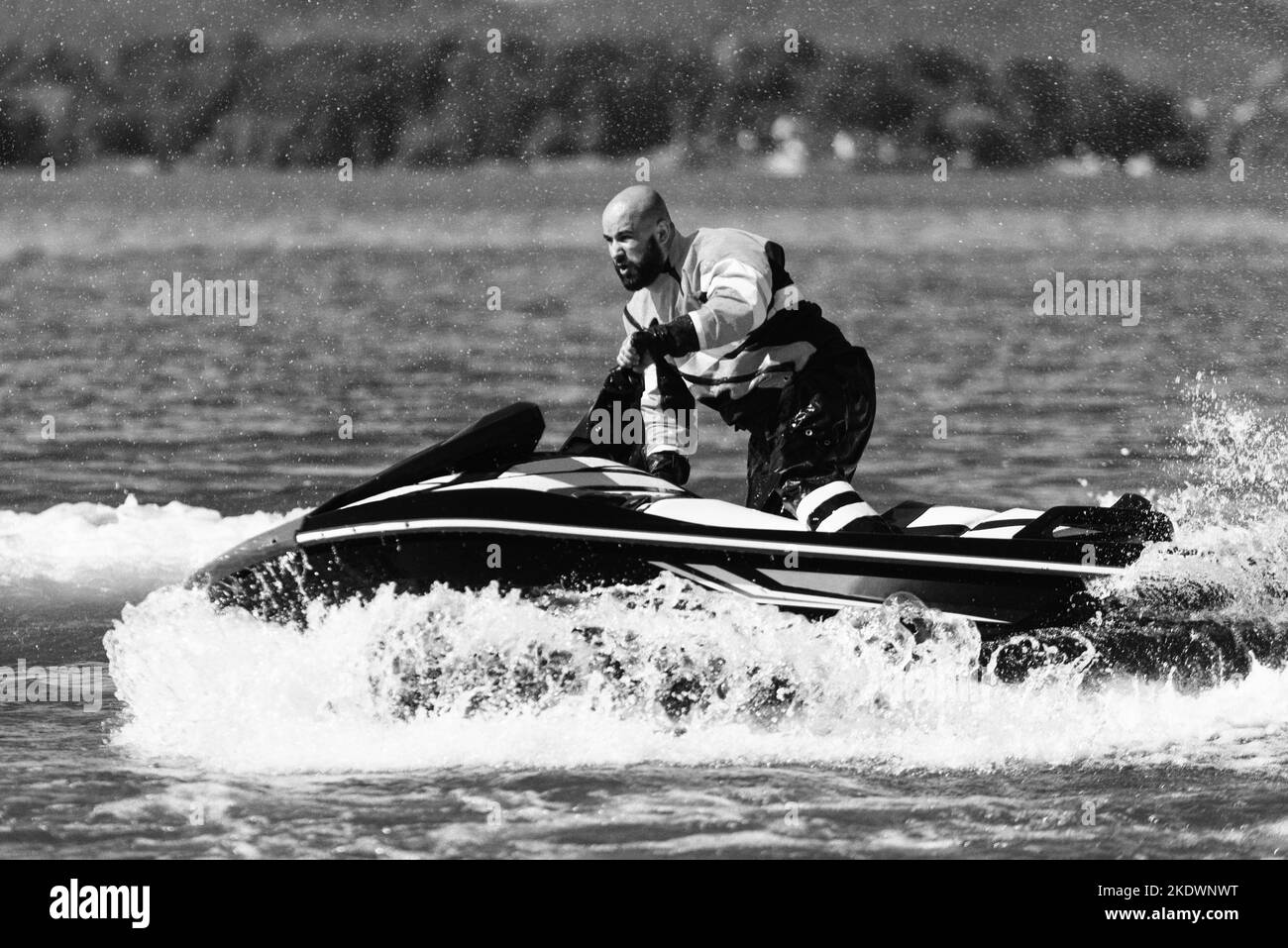Male Rescuer in Protective Uniform Wearing Life Jacket on a Jet Ski ...
