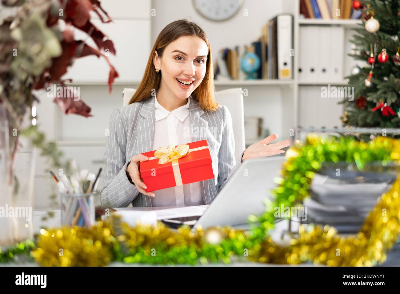 Woman receiving present in box before Christmas Stock Photo - Alamy