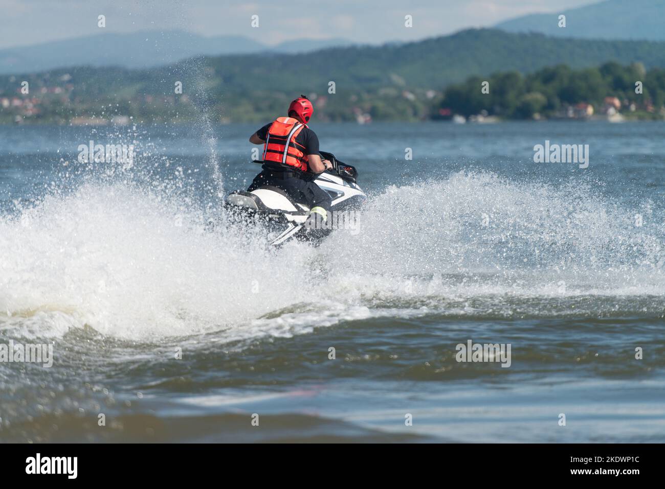 Rescuer Wearing Life Jacket in Protective Uniform on a Jet Ski Observe ...