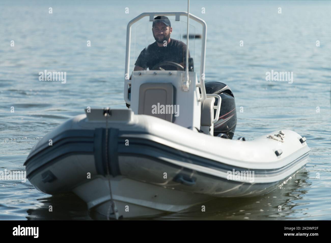 Rescuer in Protective Uniform on a Speedboat Observe the Ocean to ...