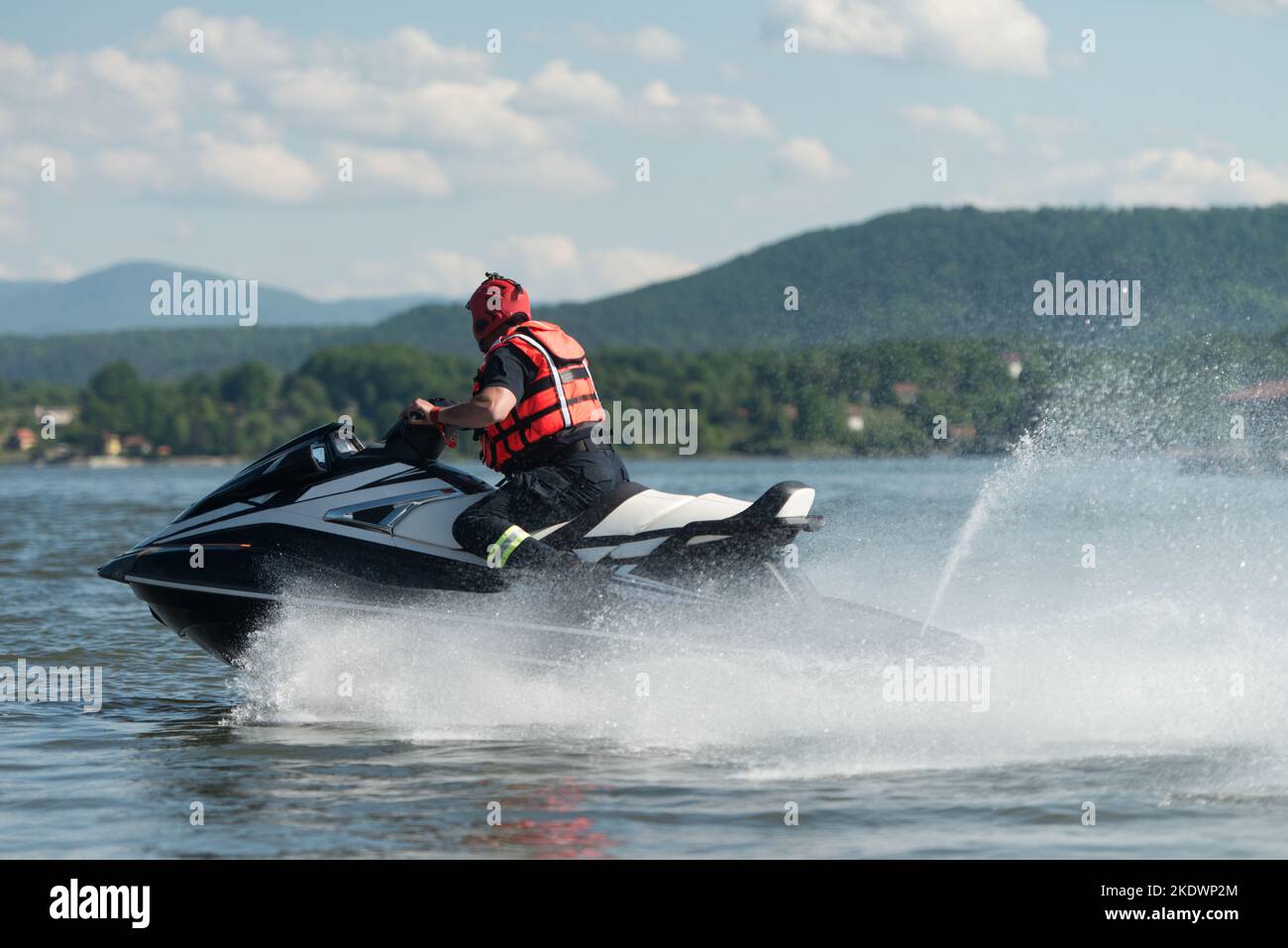 Male Rescuer in Protective Uniform Wearing Life Jacket on a Jet Ski ...