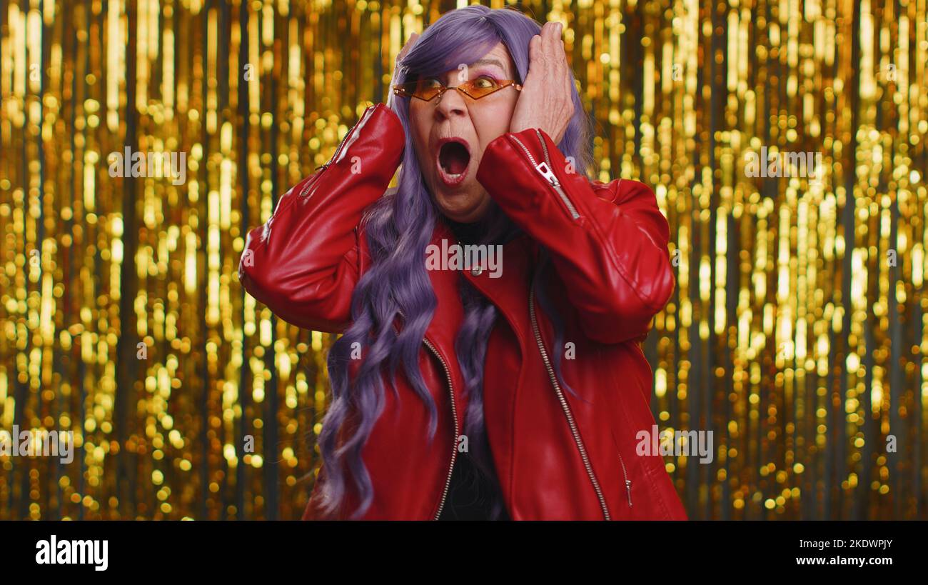 Woman with purple hairstyle screams from stress tension problems feels ...