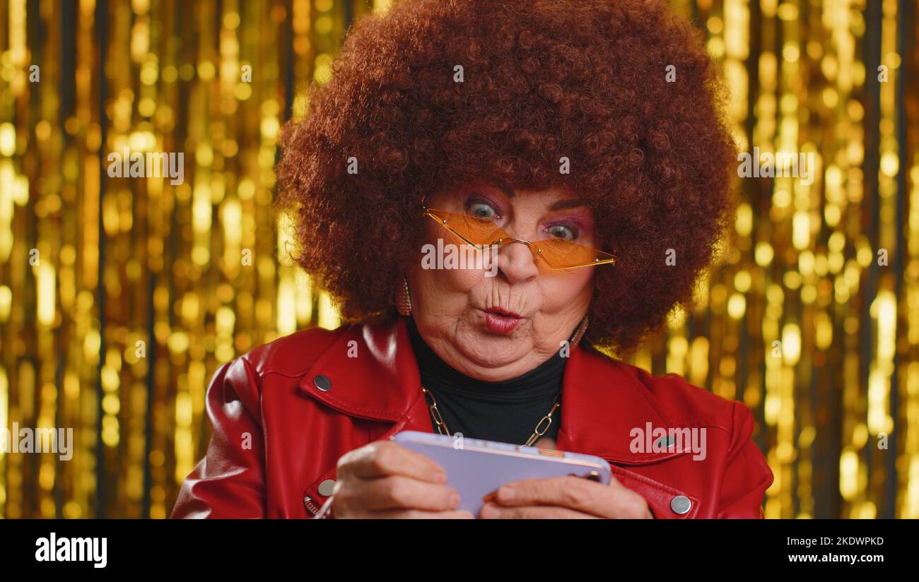 Worried funny addicted elderly woman hi-res stock photography and ...