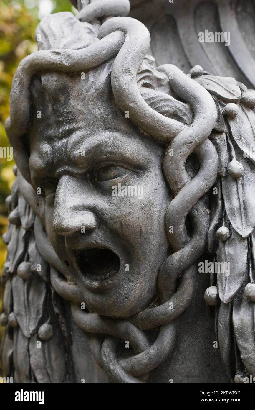Close-up of details on statue in formal garden at Schwetzingen palace ...