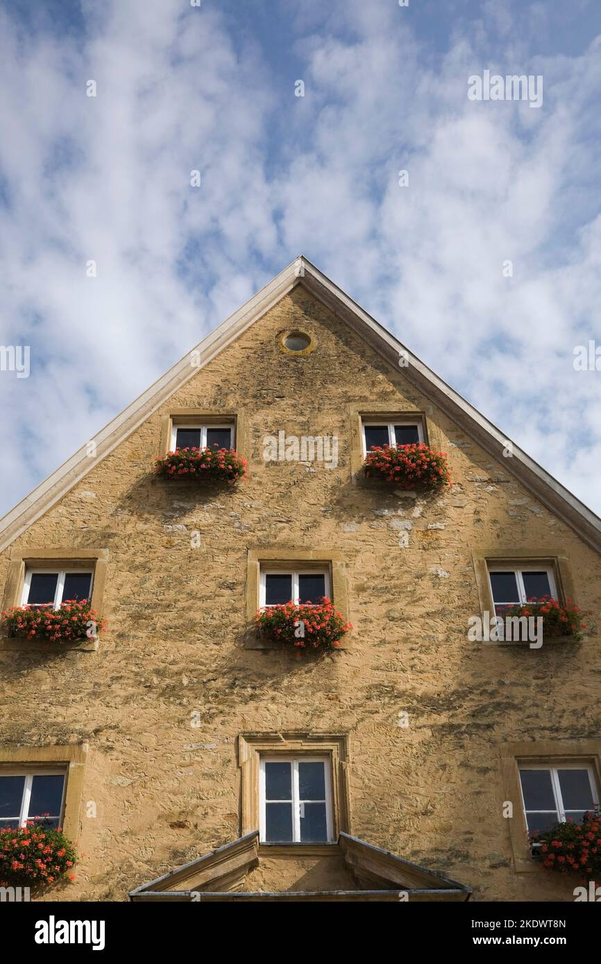Old architectural style building facade and windows decorated with red ...