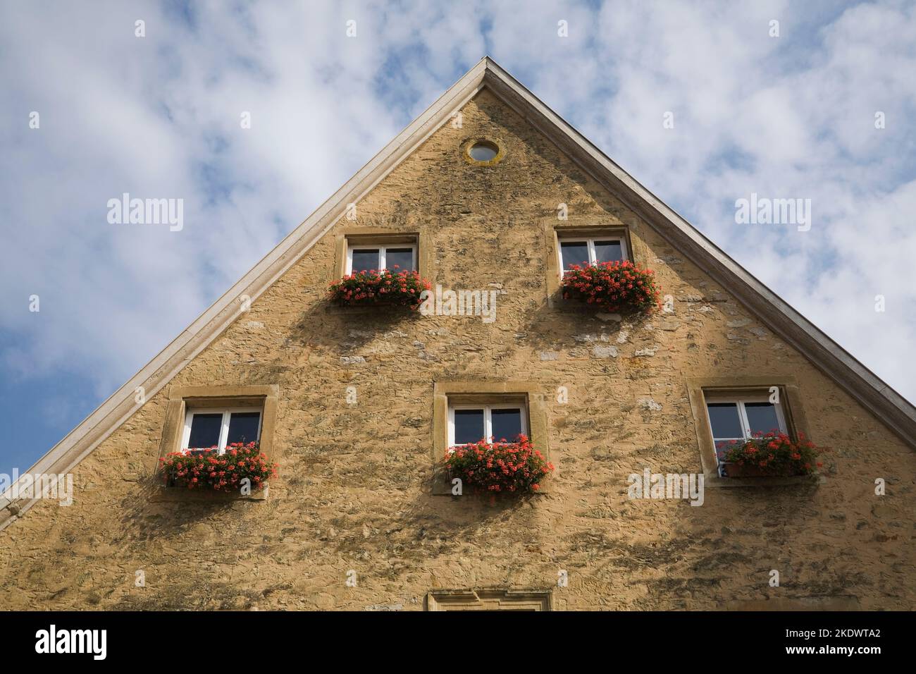 Old architectural style building facade and windows decorated with red ...
