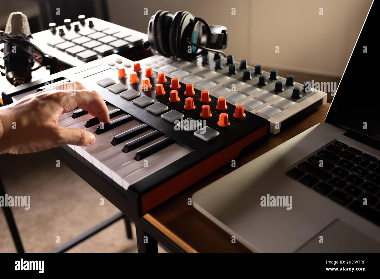 Modern studio musical equipment. Studio headphones on a midi keyboard ...