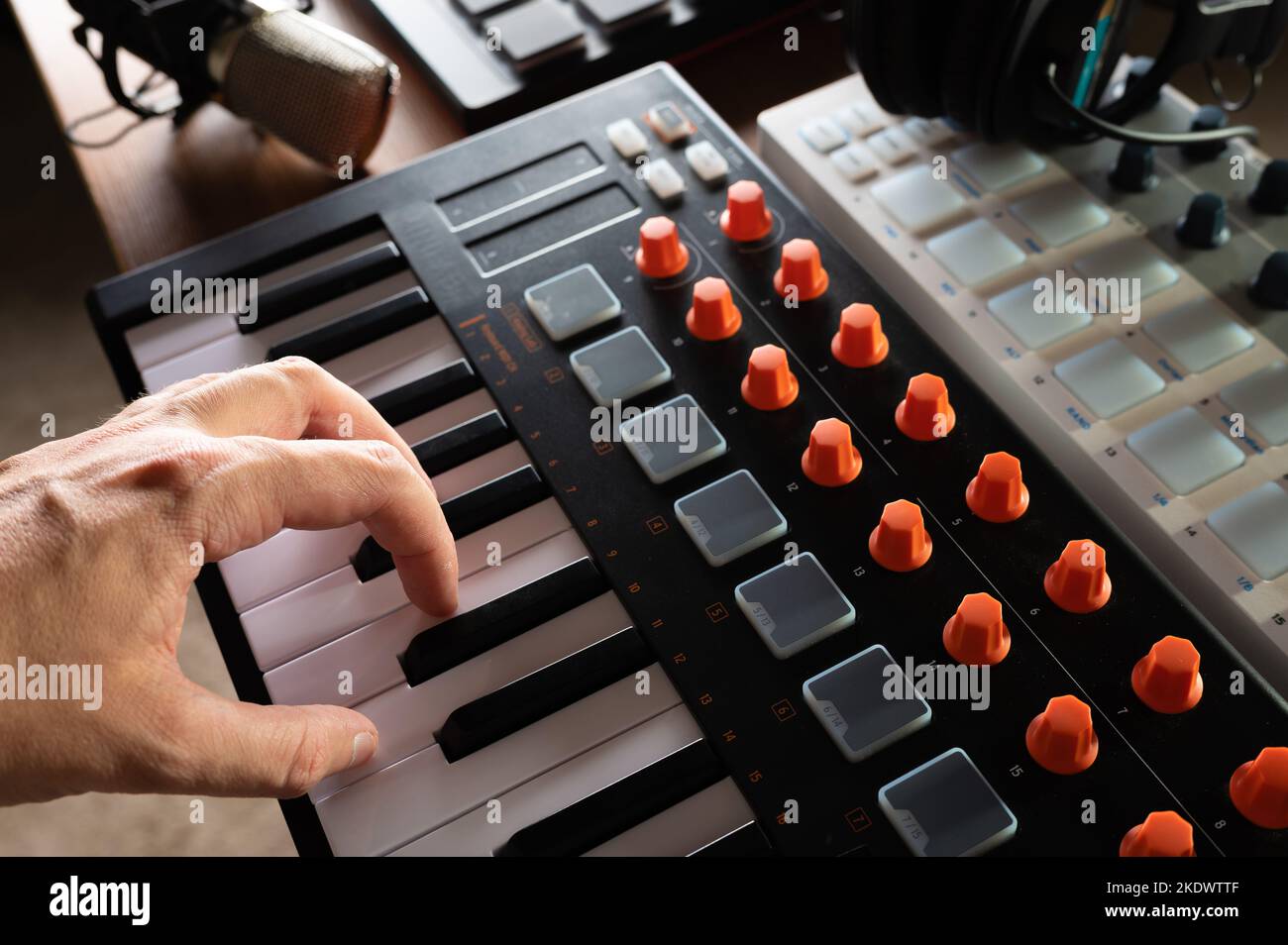 Close-up. Modern musical equipment. Musician's hand on the keys of a ...