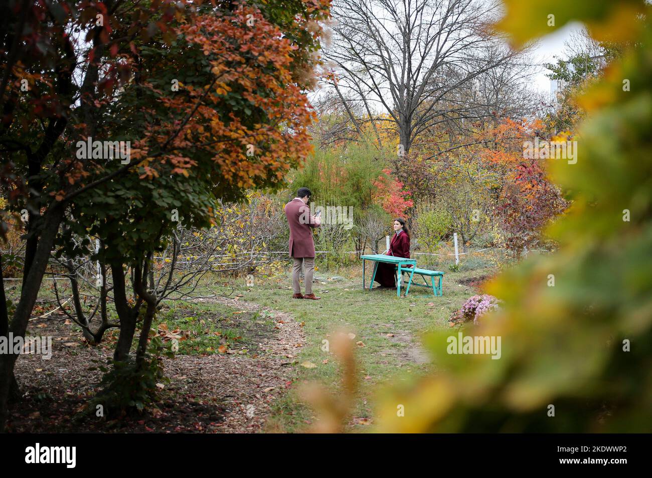 is seen taking pictures in the Botanical Garden on French Boulevard ...