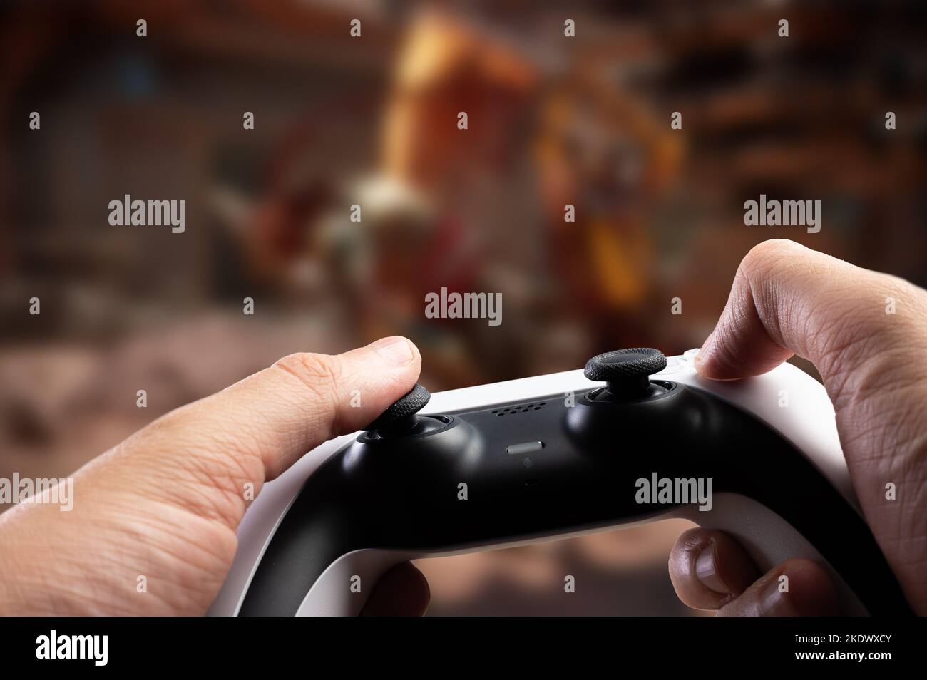 Gamepad GAM22ICB in the hands of a gamer against the background of a ...