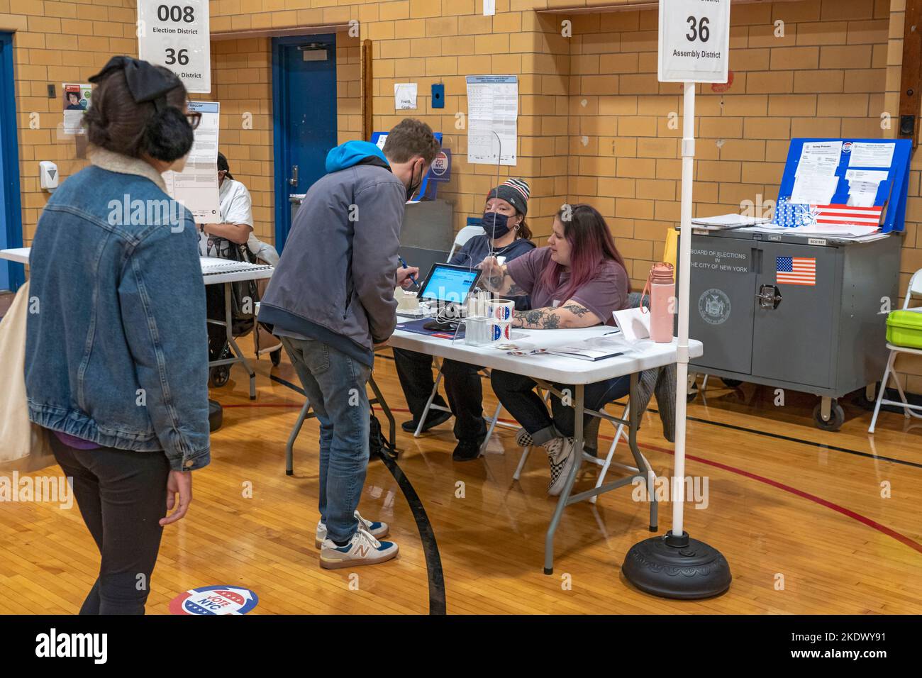 NEW YORK, NY - NOVEMBER 08: A man checks-in as he prepares to vote on ...