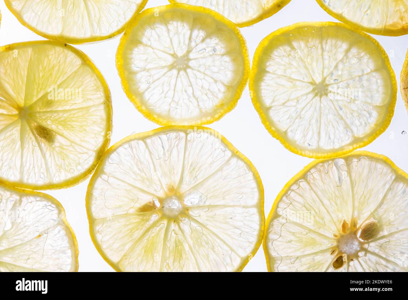 Juicy lemon slices with bubbles under water isolated on white ...