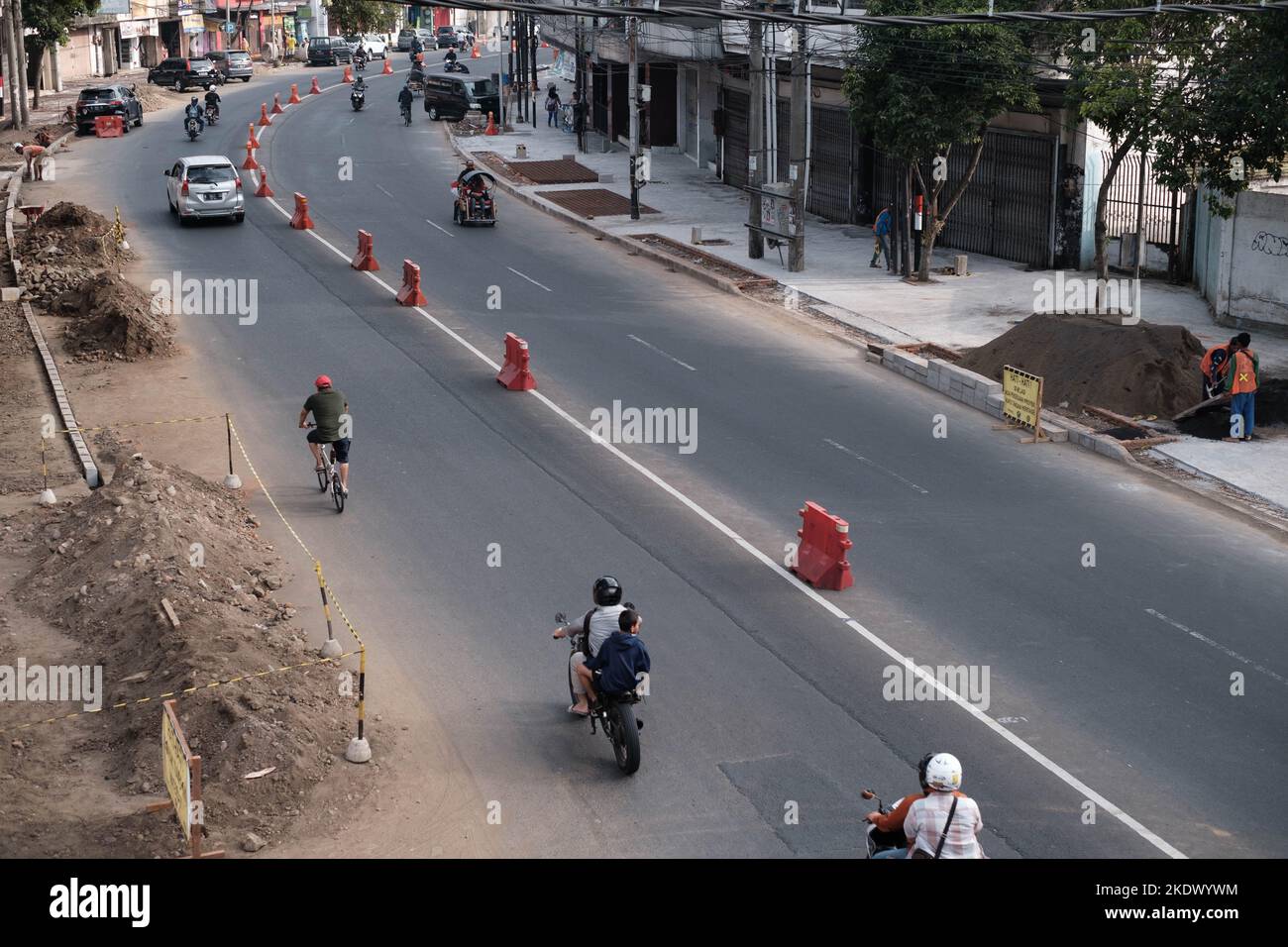 Morning activities in a street in Malang city, East Java, Indonesia ...