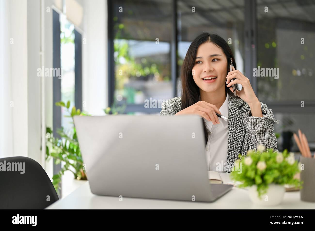 Charming and gorgeous young Asian businesswoman or female manager in ...