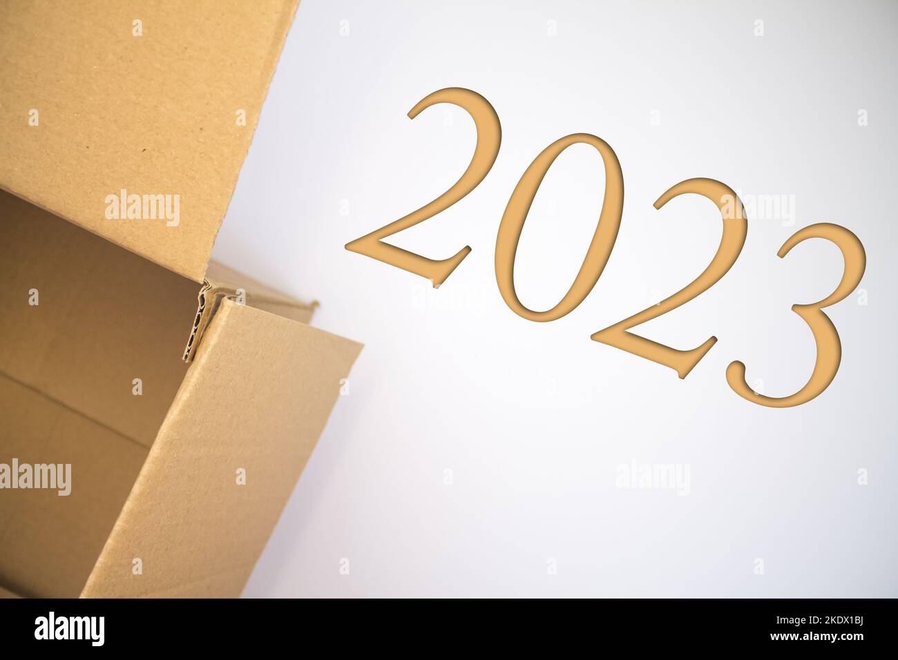The number 2023 with cardboard box. Brown folded card box Stock Photo ...