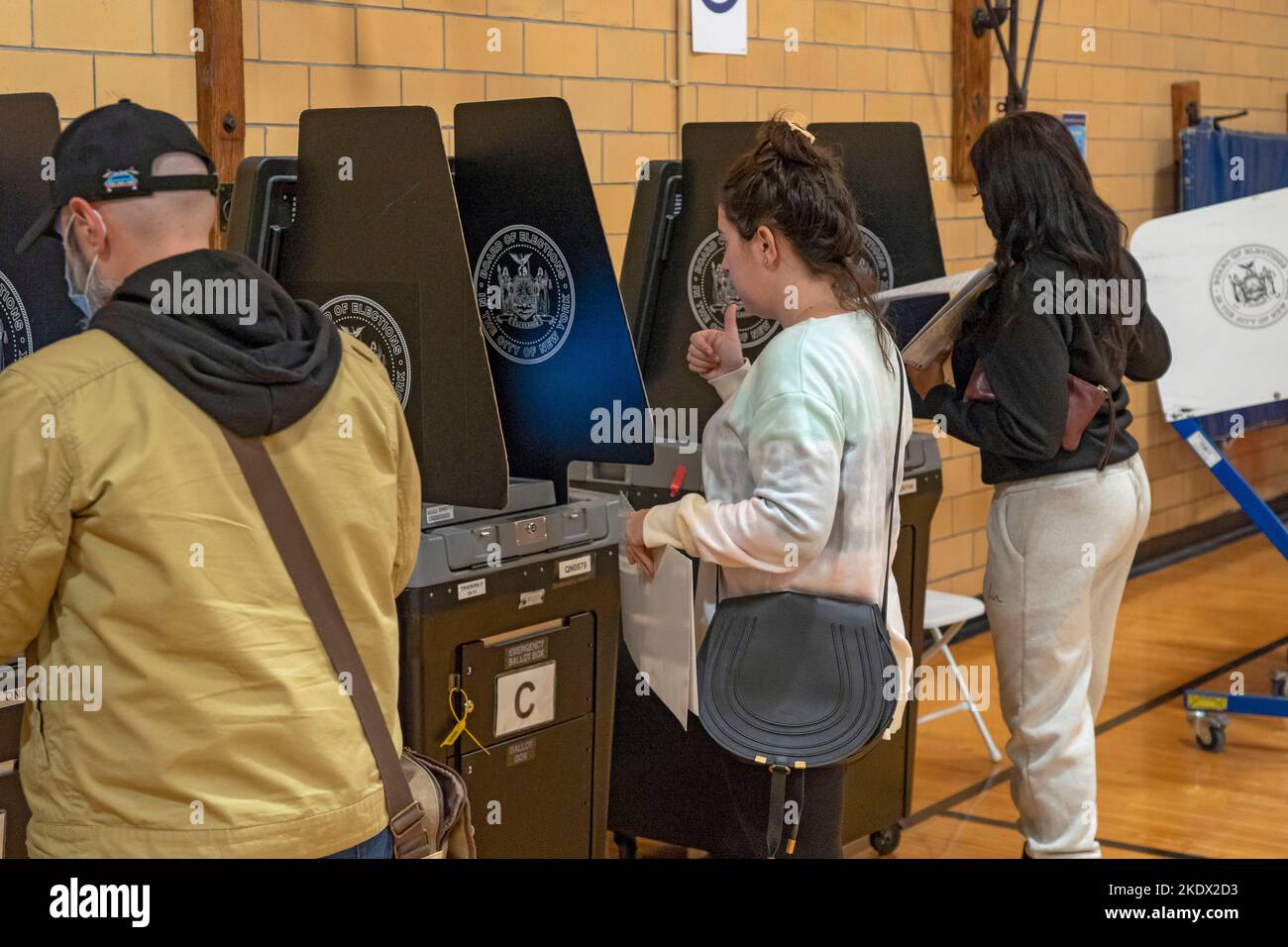 New York, United States. 08th Nov, 2022. People scan their voting cards ...