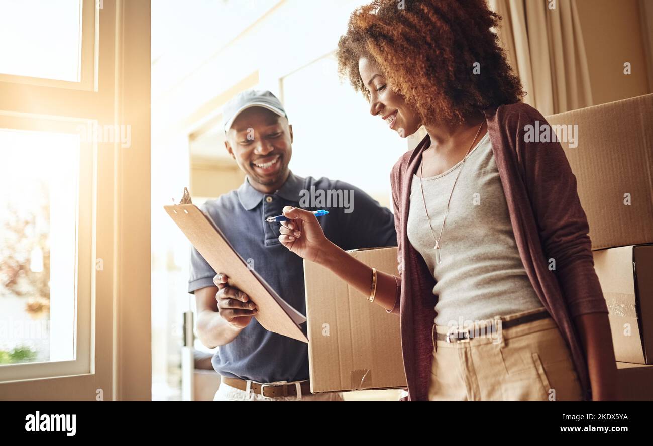 Just sign on the dotted line. an attractive young woman signing for a ...