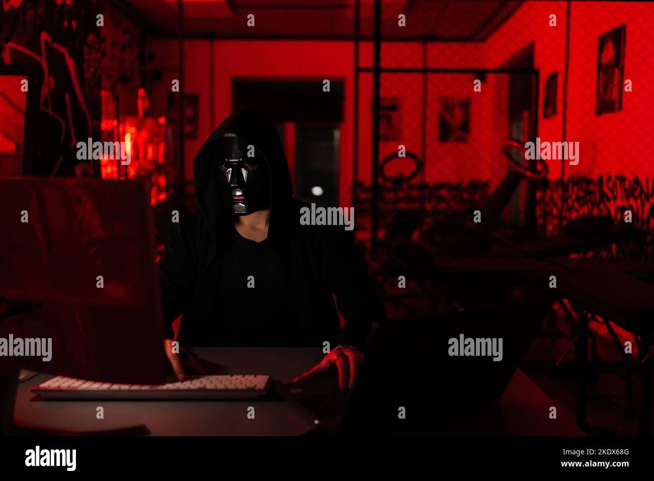 Portrait Of Wanted Unrecognizable Hacker Man Wearing In Black Mask And