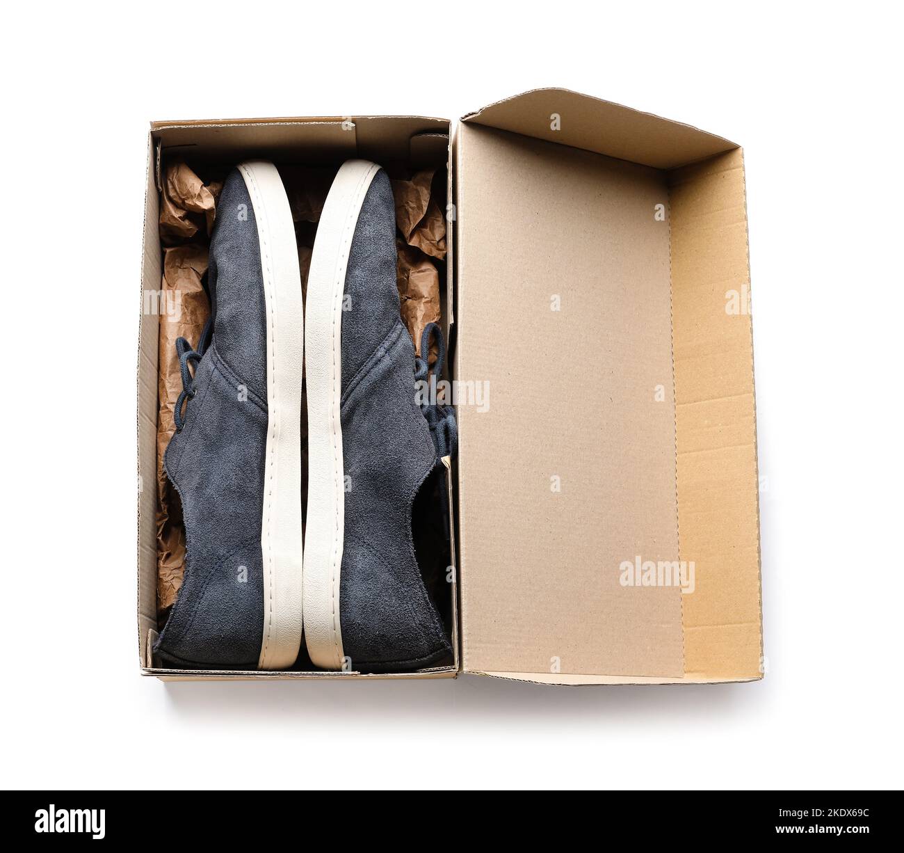 Cardboard box with sneakers on white background Stock Photo - Alamy