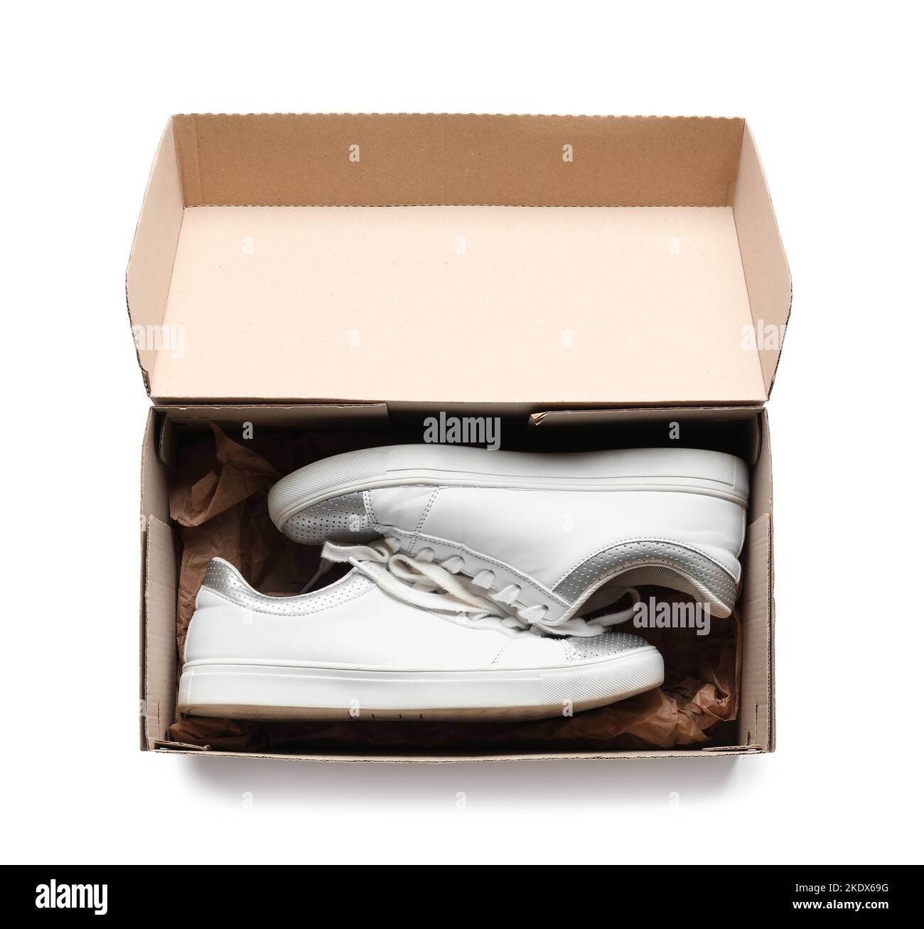 Cardboard box with sneakers on white background Stock Photo - Alamy