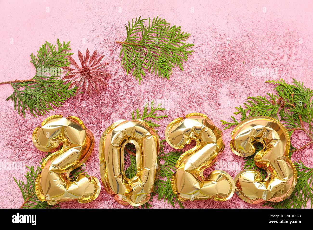 Figure 2023 made of balloons with Christmas branches and glitter on ...