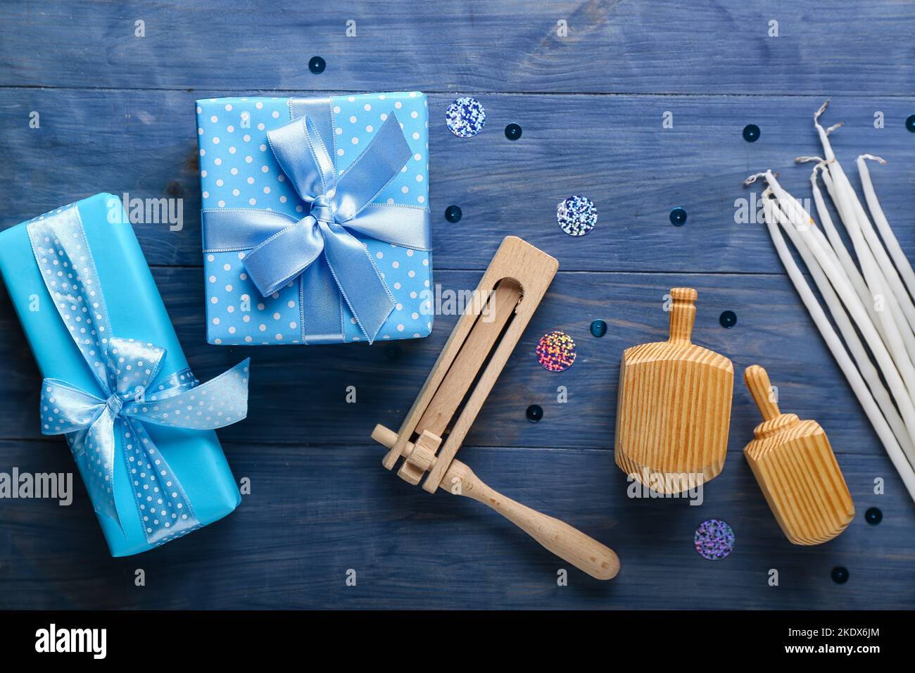 Gifts with rattle, dreidels and candles for Hannukah celebration on ...