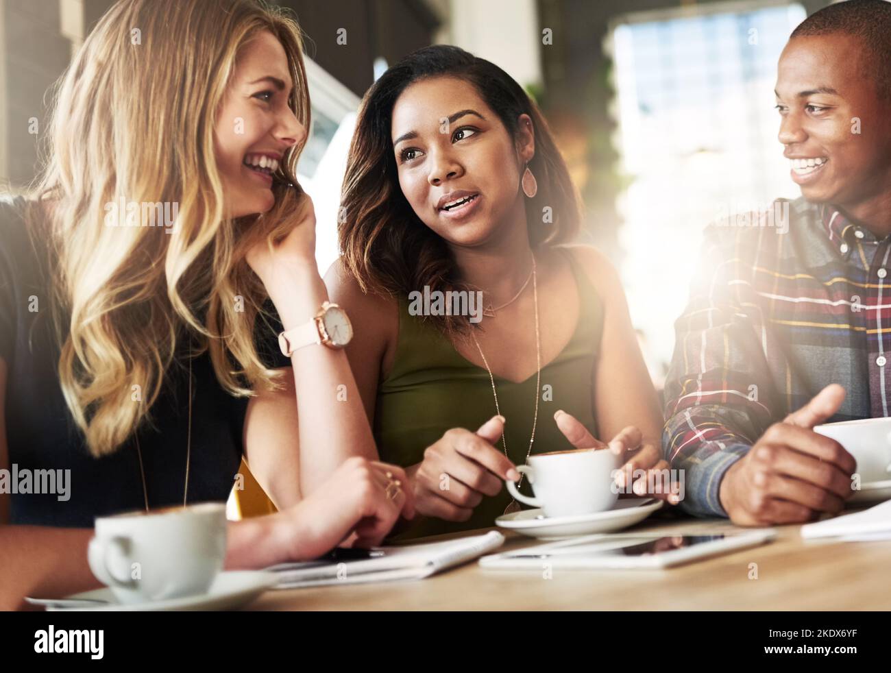 The best of friends. a group of friends catching up over coffee in a ...