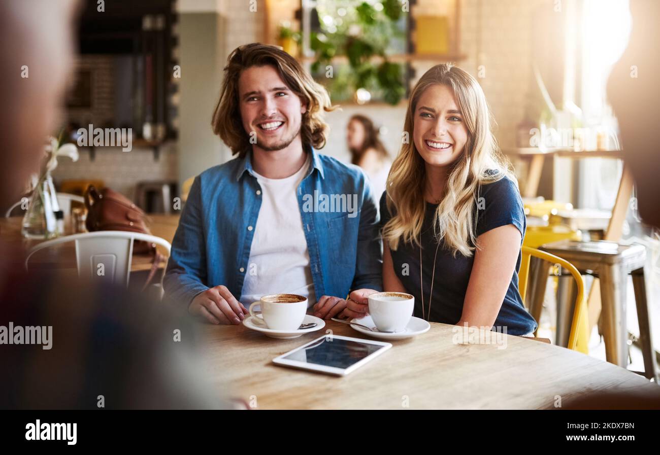 Sharing their happiness. a couple enjoying a double date with friends ...