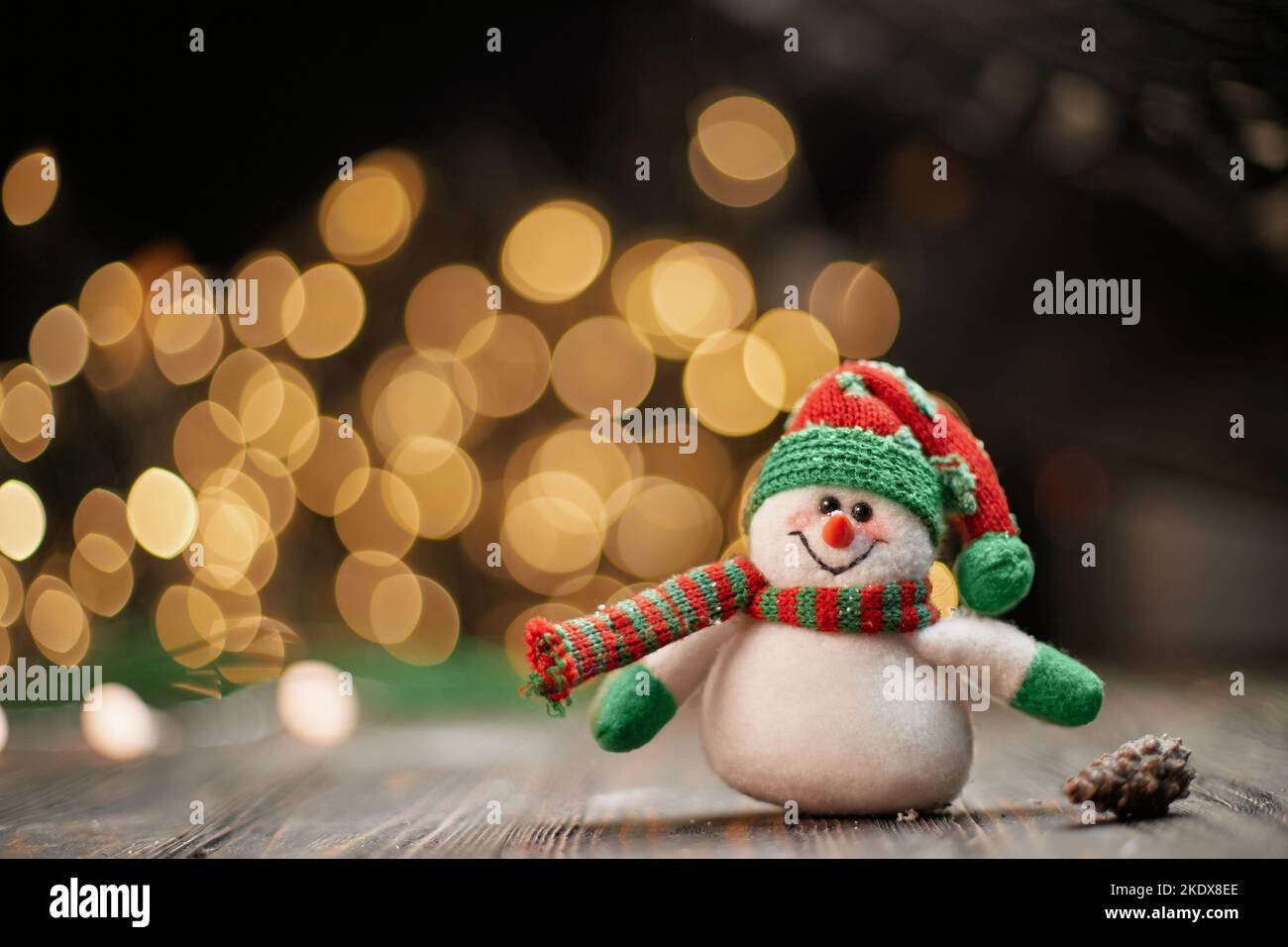 toy snowman on the background of Christmas lights Stock Photo - Alamy